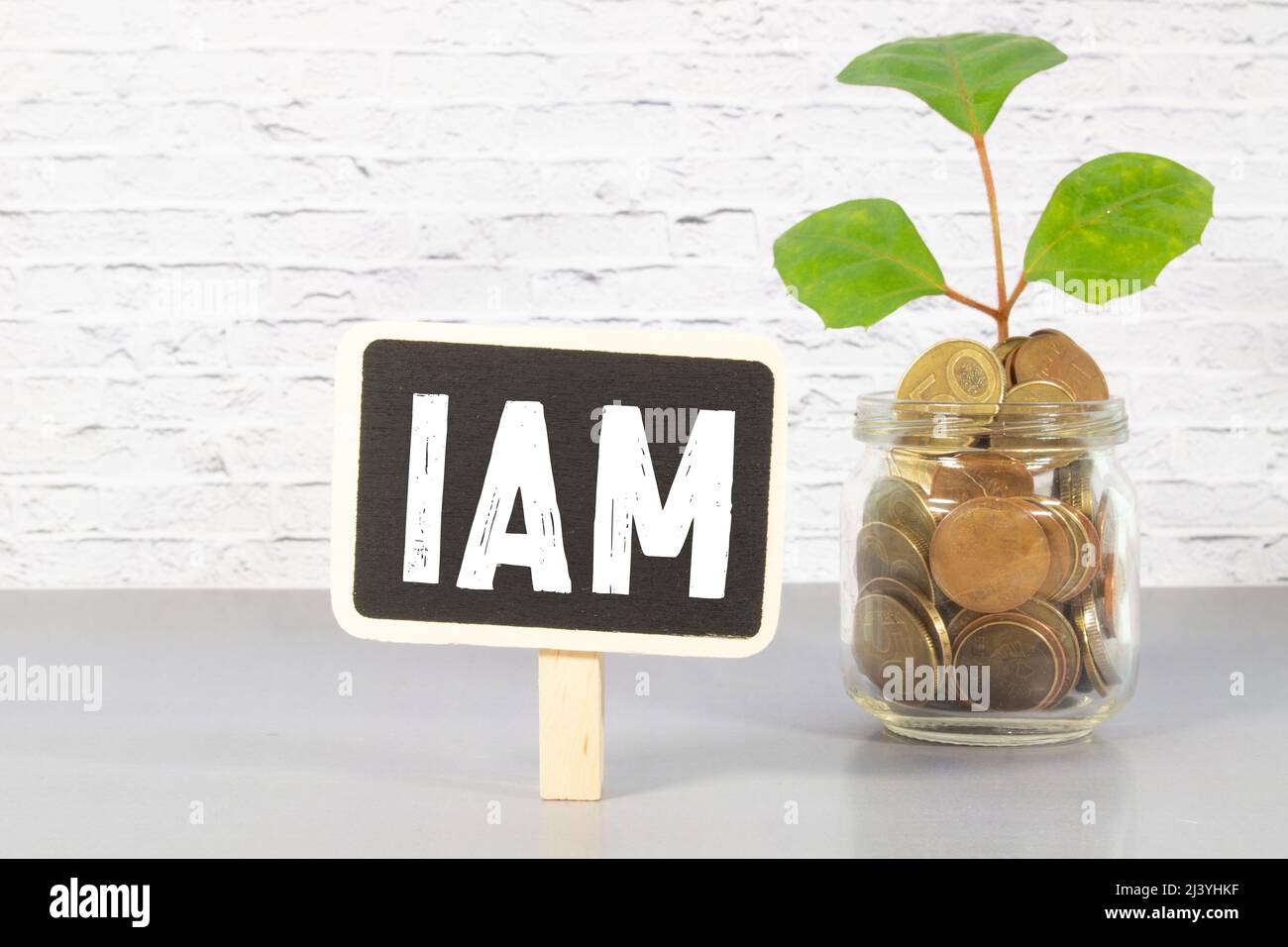 Closeup on businessman holding a card with IAM IDENTITY AND ACCESS ...