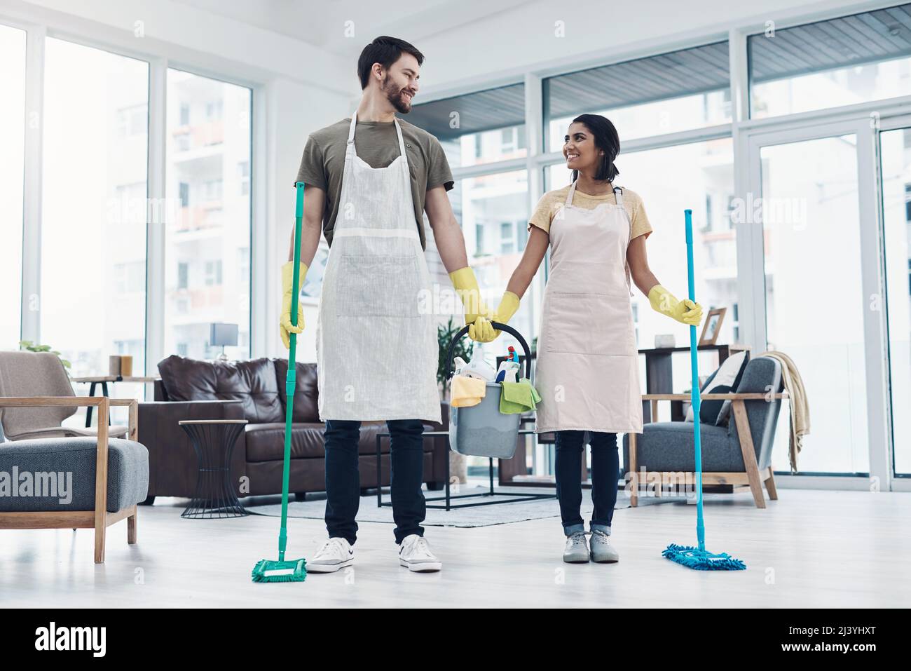 With teamwork, housework doesnt have to be hard. Shot of a happy young ...