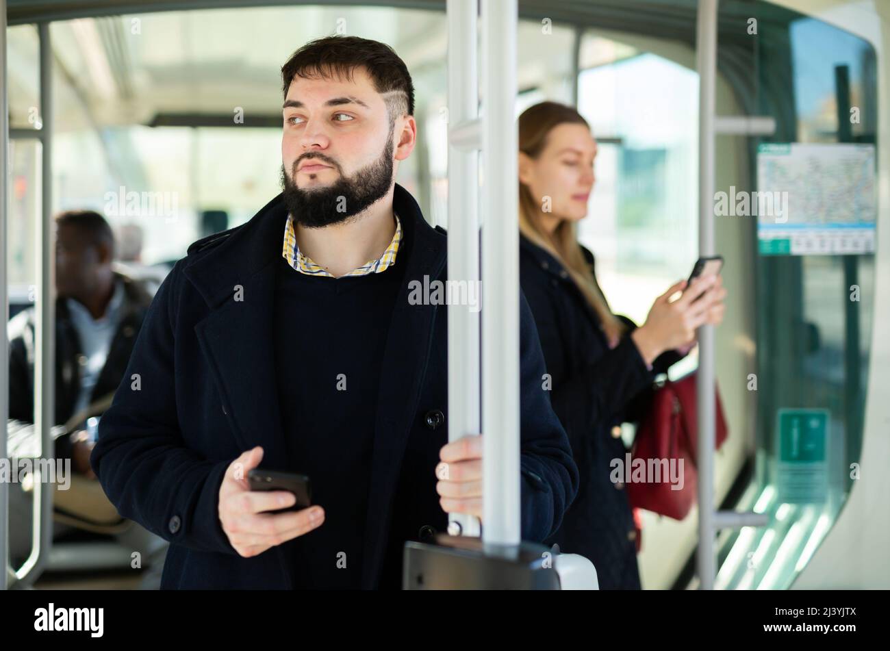 Guy in city bus Stock Photo - Alamy
