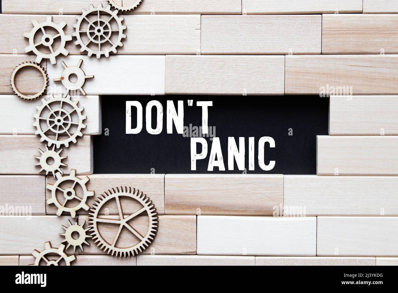 text DON'T PANIC wooden block and black background Stock Photo - Alamy