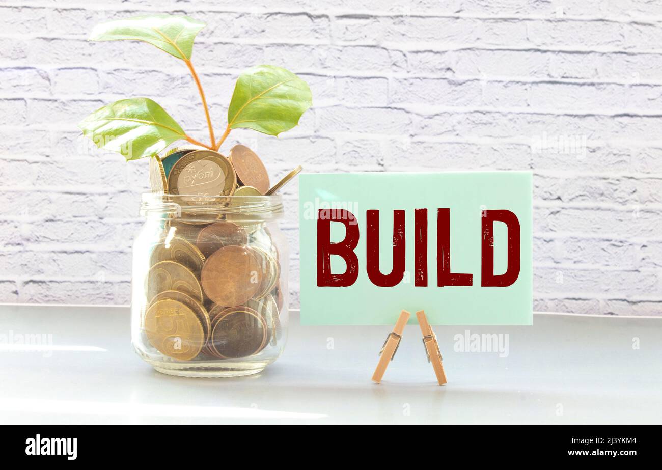 BUILD word from wooden blocks on white desk Stock Photo - Alamy