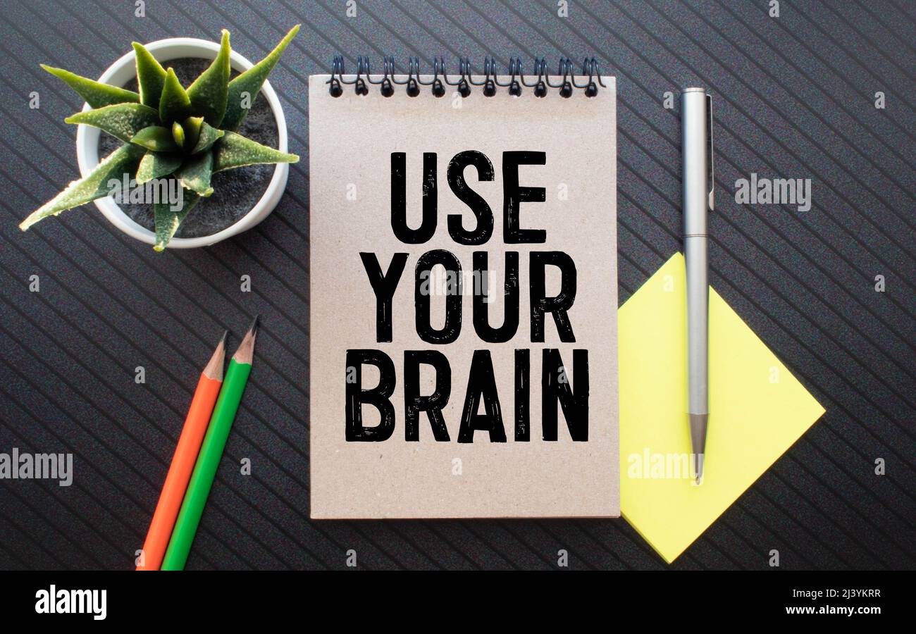 The phrase Use Your Brain in blue text on an index card pinned to a ...