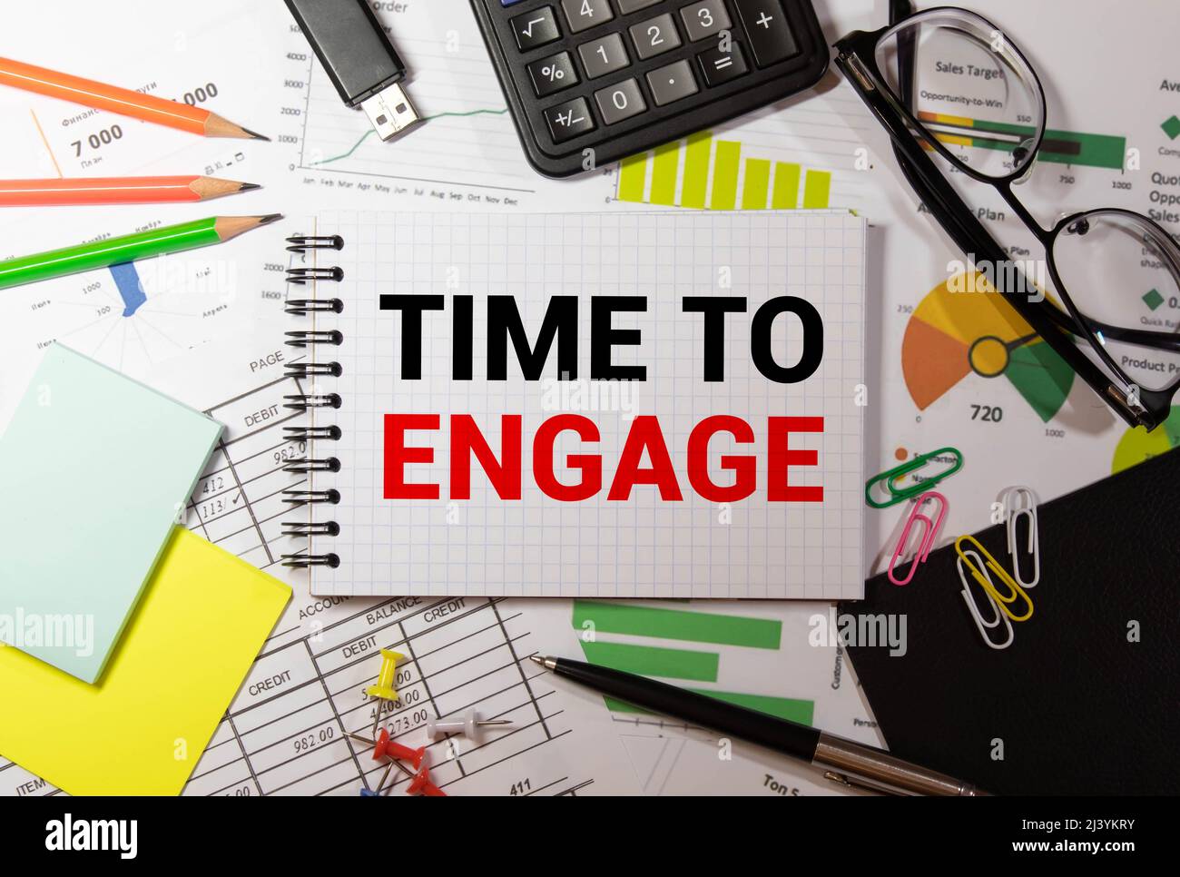 text TIME TO ENGAGE on the white short note paper yellow background ...