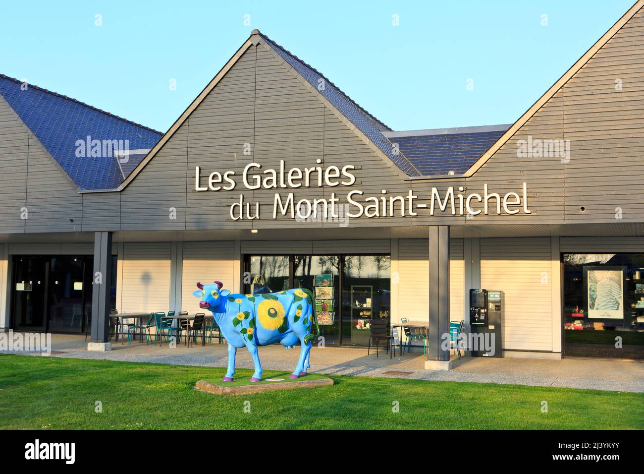 A Norman cow (symbol of Normandy) beautifully decorated with yellow ...
