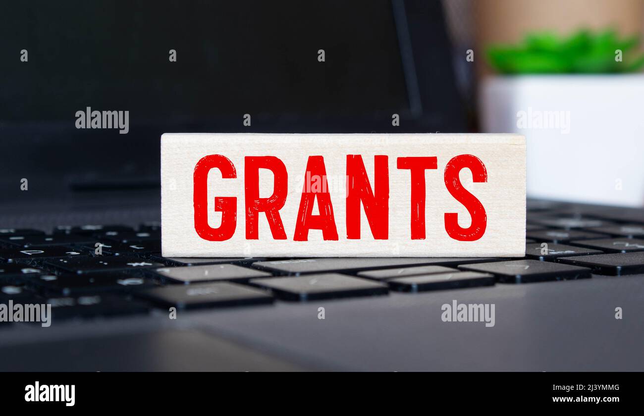 grants word on paper folder showing scholarship or higher education ...