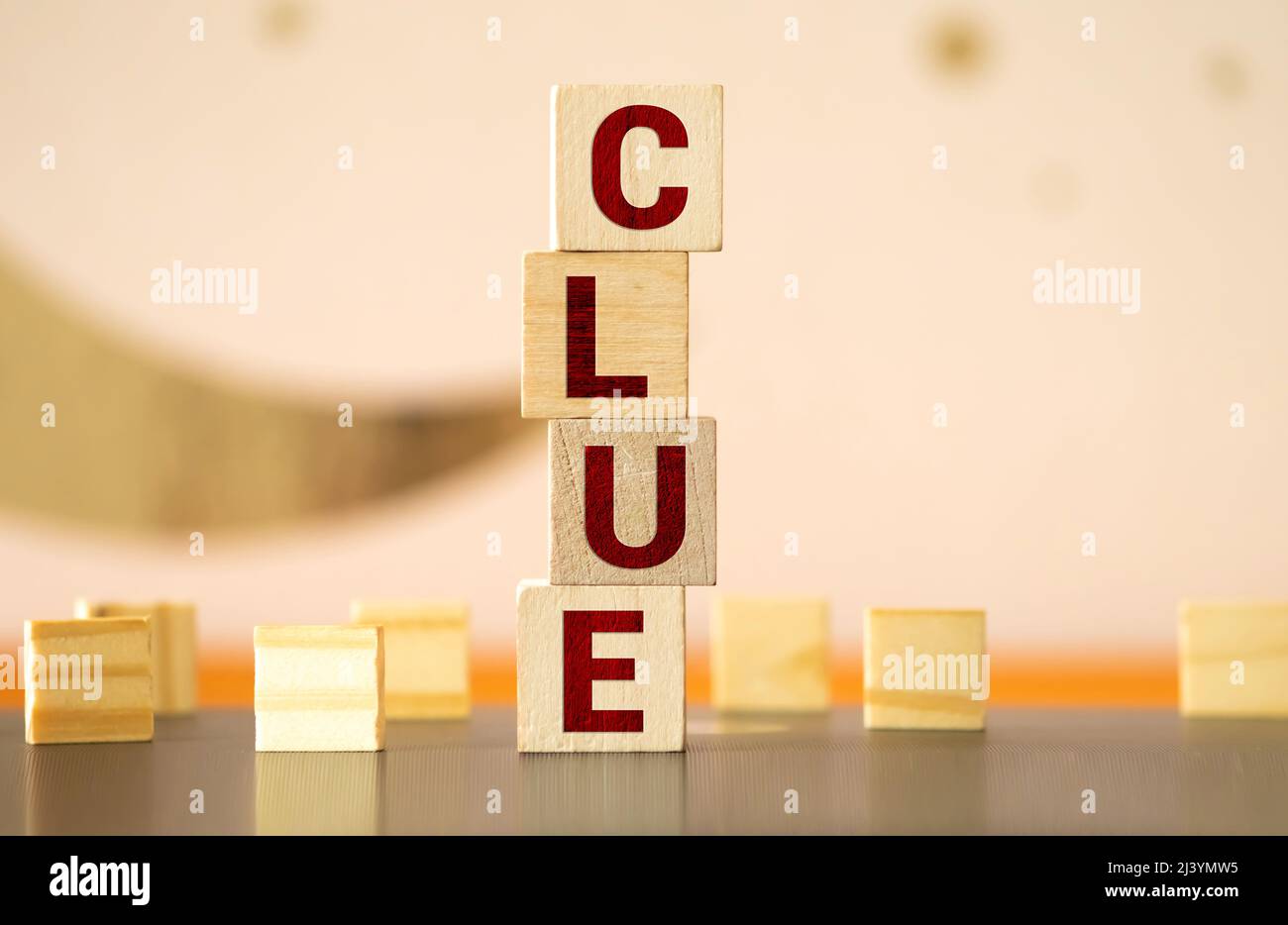 Clue word from wooden blocks on desk Stock Photo - Alamy