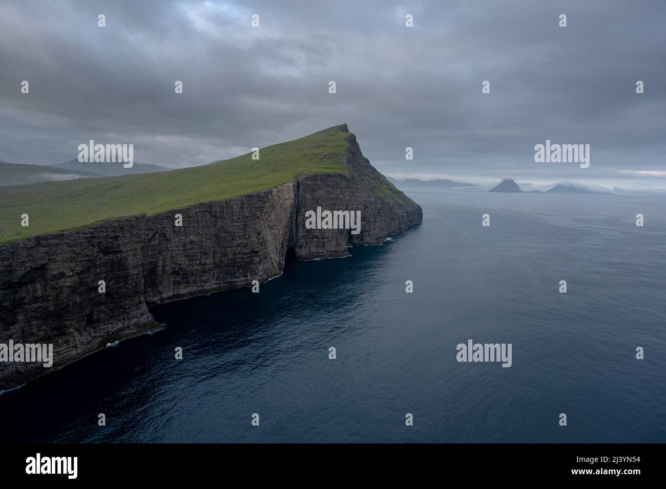 Beautiful cinematic aerial view of the Bøsdalafossur waterfall and ...