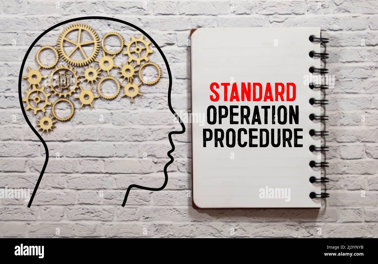 Standard Operating Procedure text on paper in open diary with ...