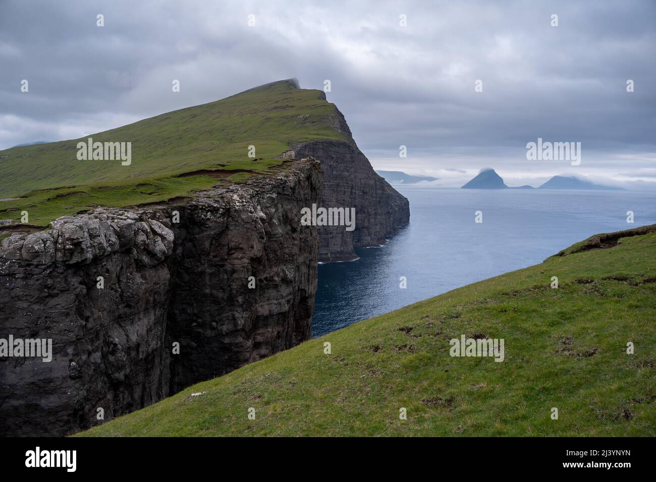 Beautiful cinematic aerial view of the Bøsdalafossur waterfall and ...