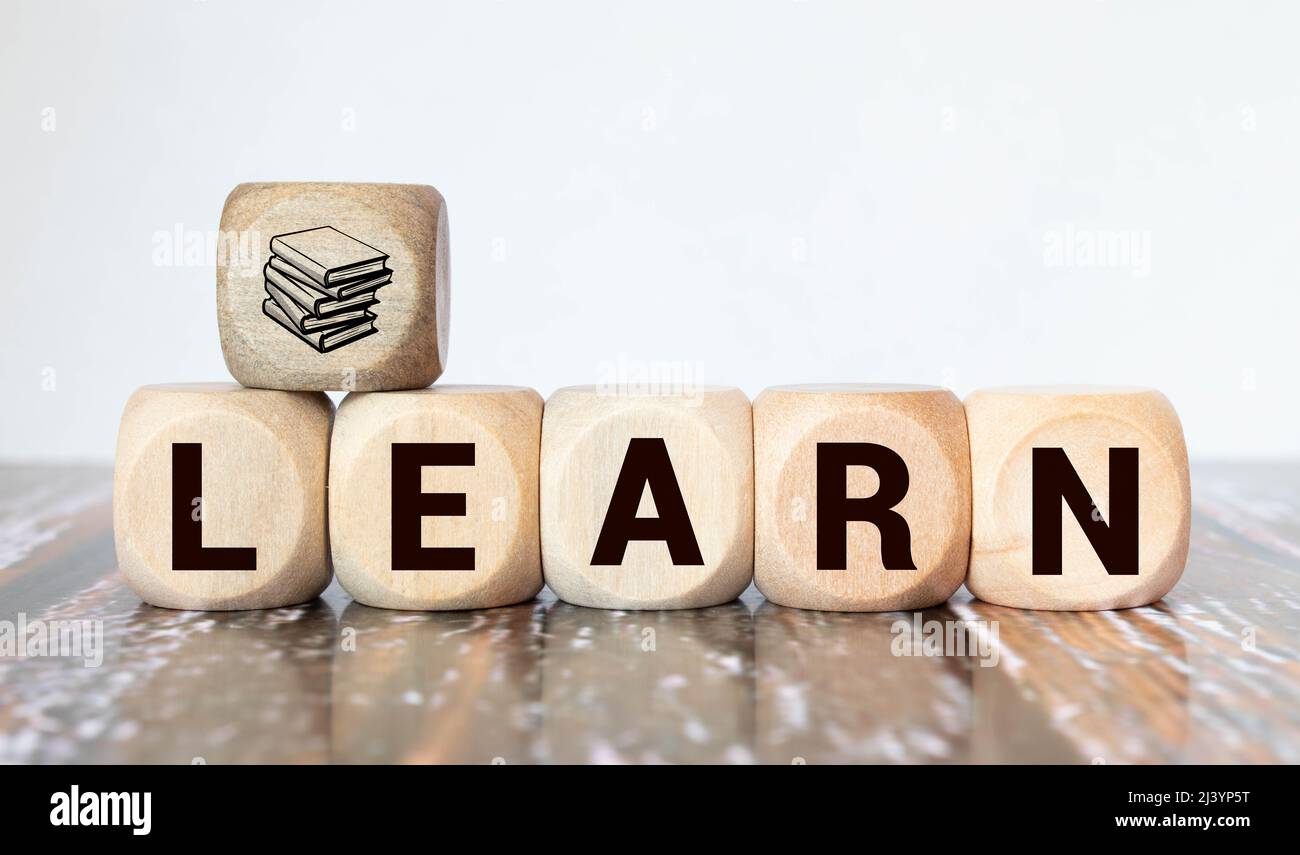 LEARN word written on wood block Stock Photo - Alamy
