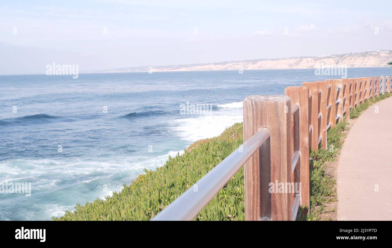 Ocean waves crashing on beach, sea water surface from above, cliff or ...