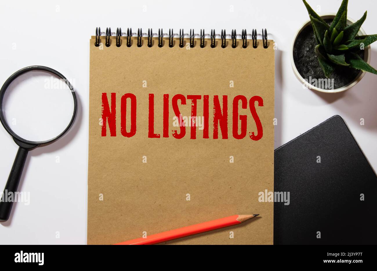 Notepad with text invest on the business charts and pen,business Stock ...