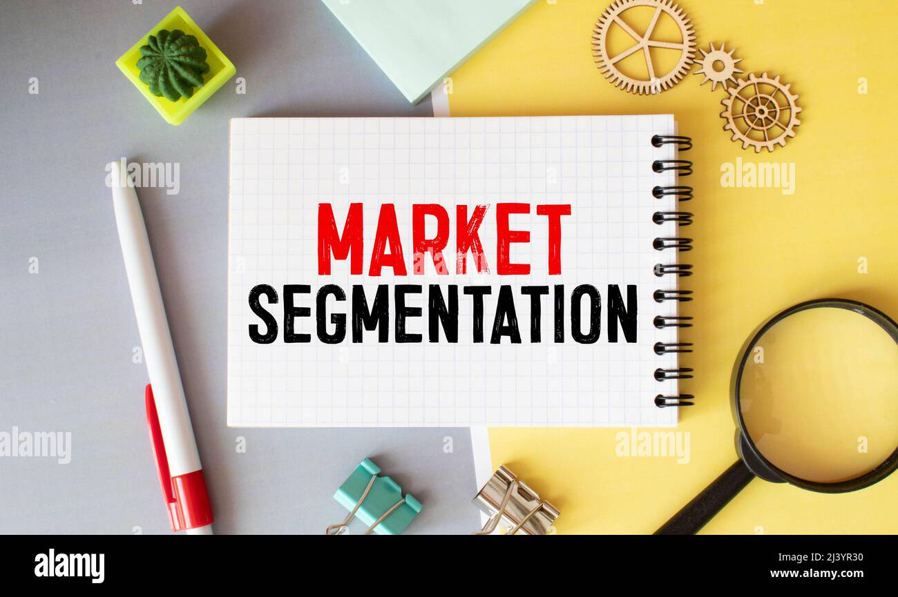 white paper with text Market Segmentation on a black background with ...