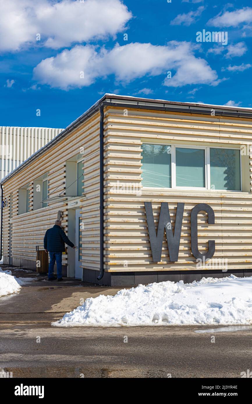Moscow, Russia - April 04, 2022: street public toilet that a man enters ...