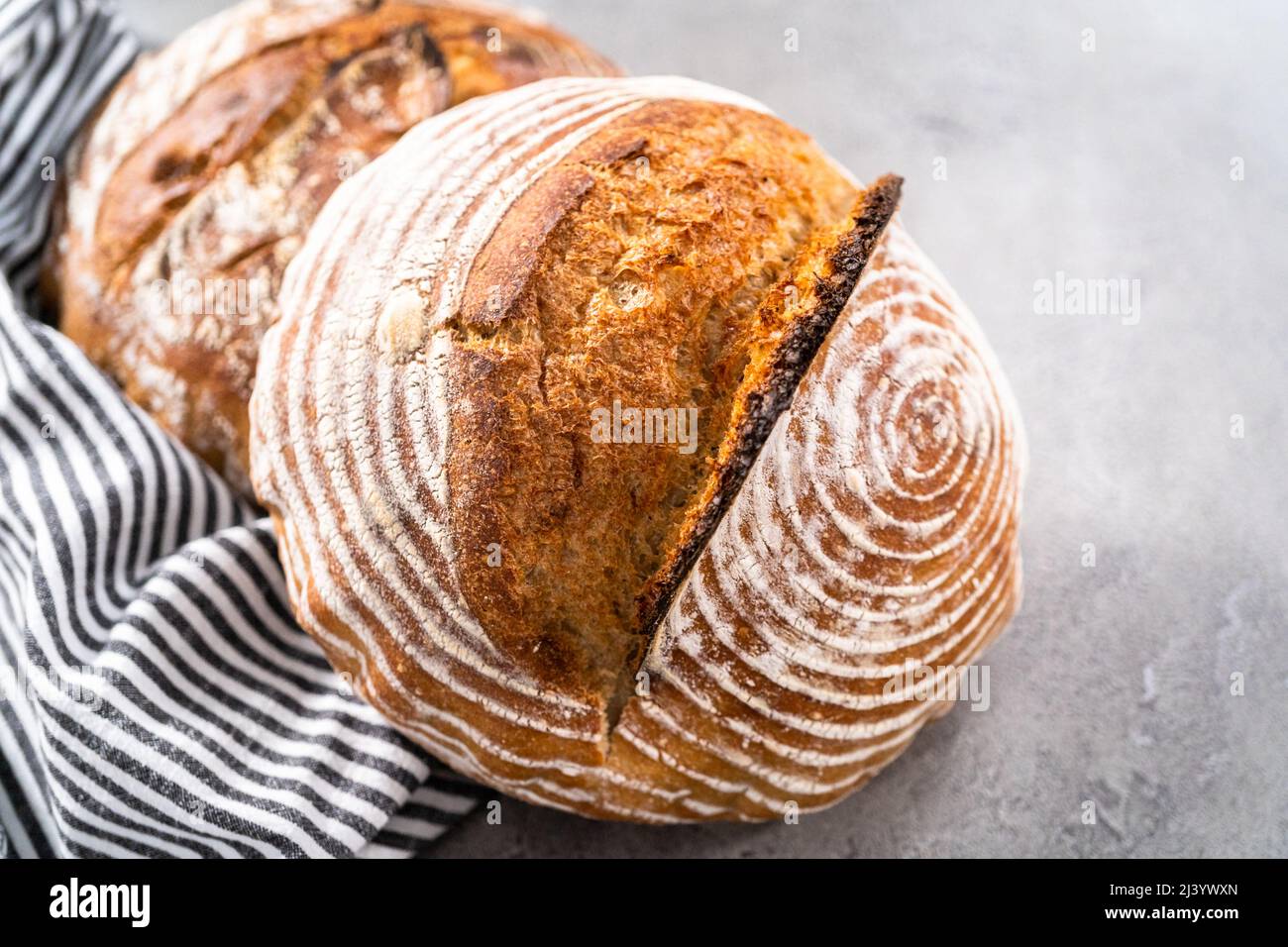Freshly baked loaf of a wheat sourdough bread with marks from bread ...