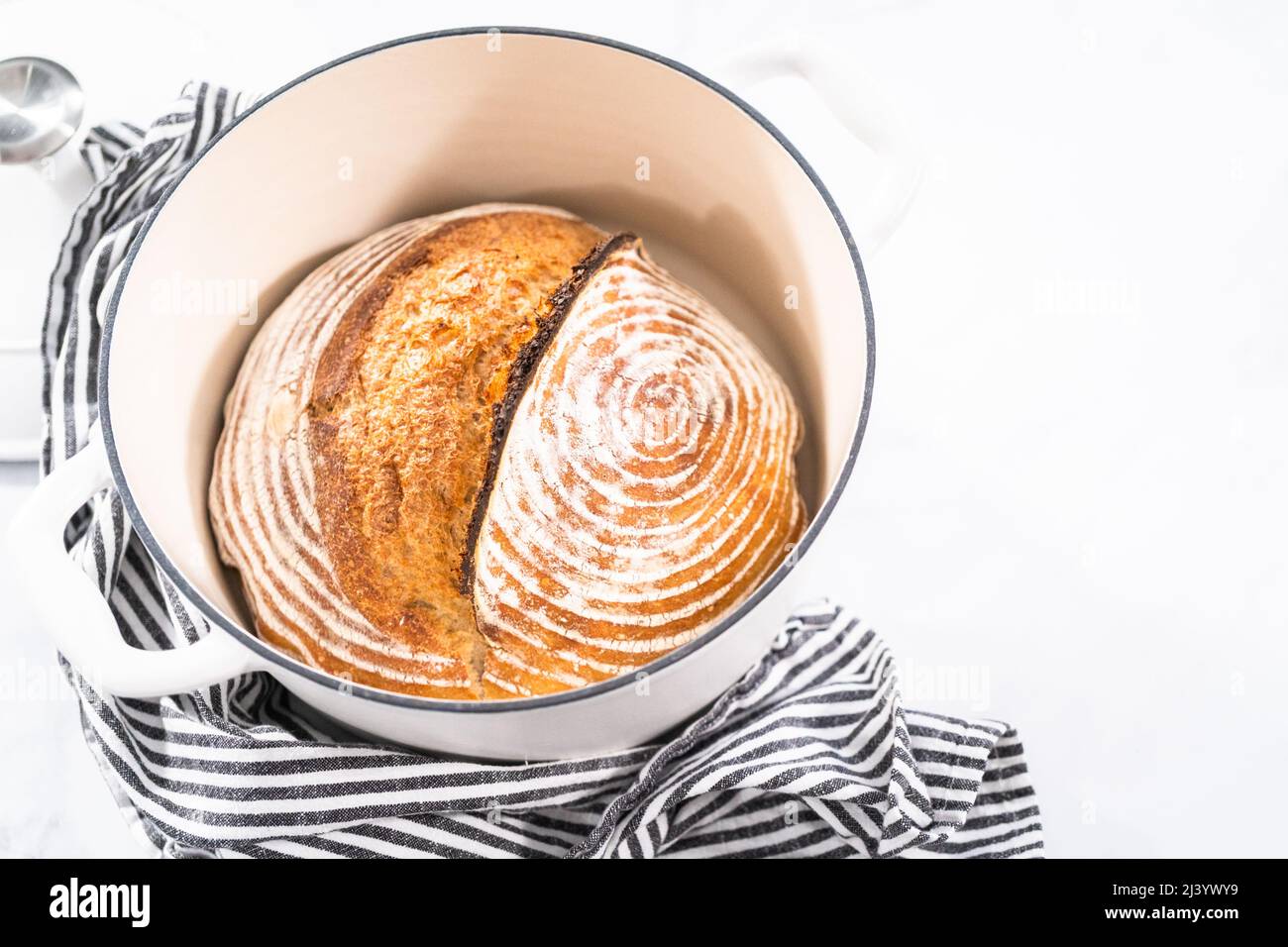 Freshly baked loaf of a wheat sourdough bread with marks from bread ...