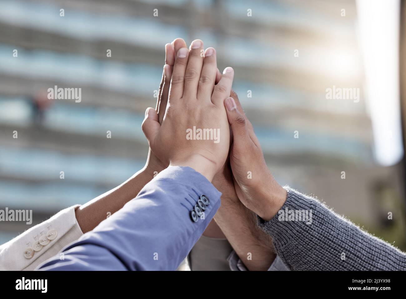 Can I get a yes. Shot of a group of unrecognizable businessmen giving a ...