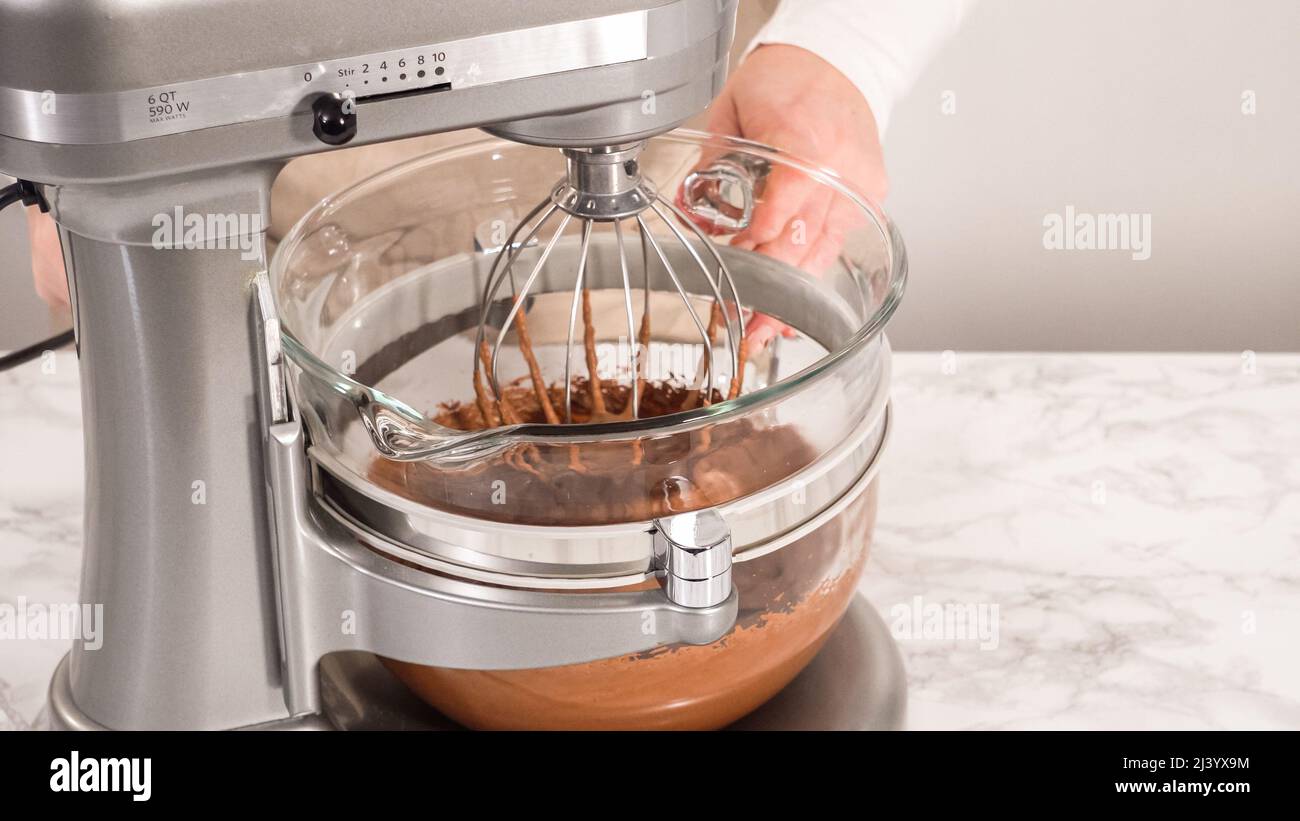 Step by step. Whipping chocolate ganache with an electric kitchen mixer ...