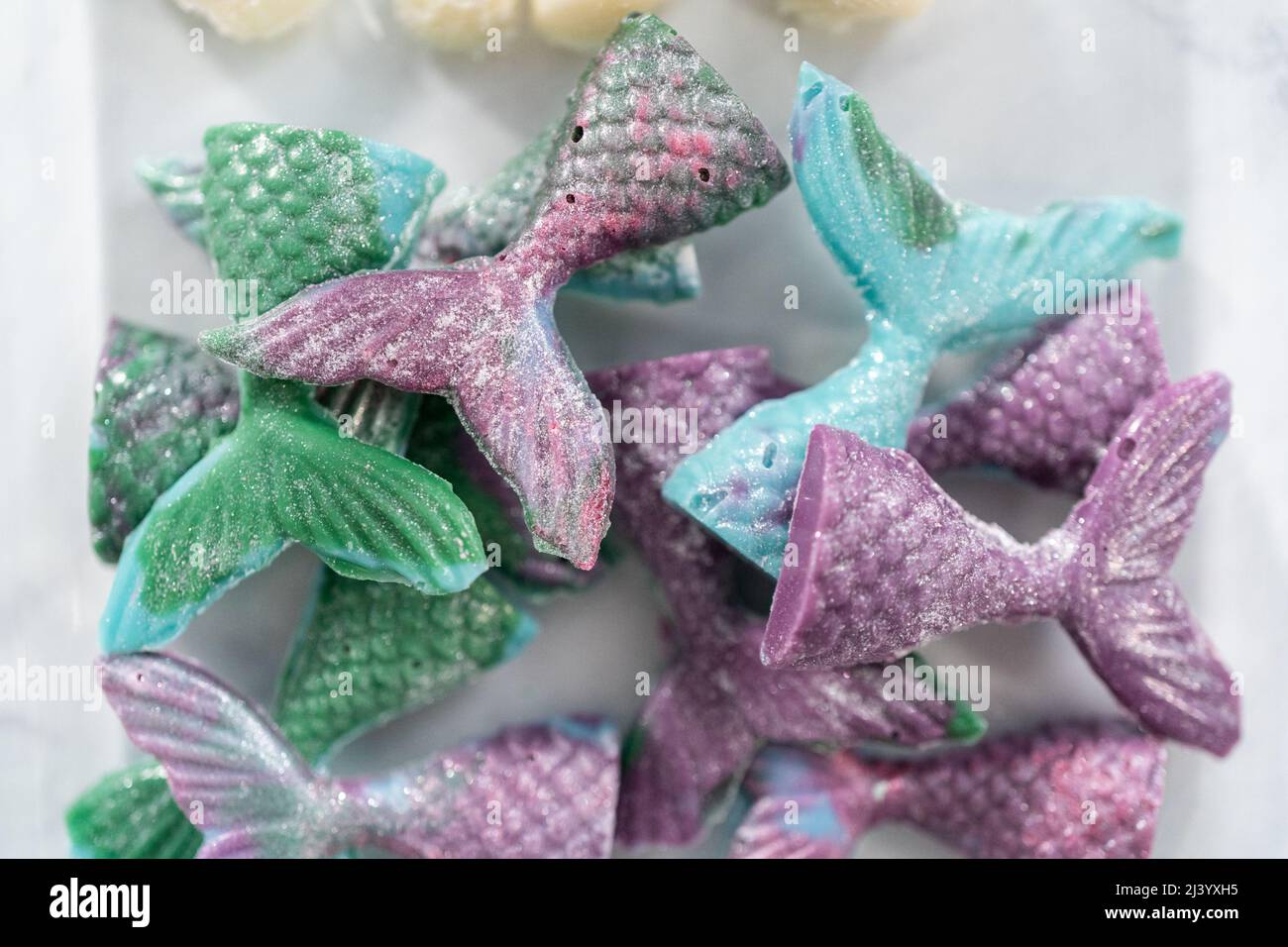 Chocolate seashells and mermaid tails in a glass container Stock Photo ...
