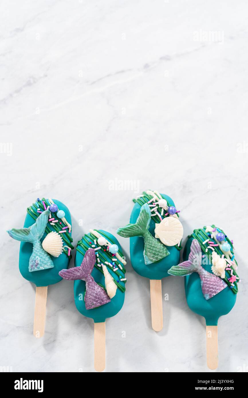 Mermaid cakesicles with drizzled chocolate, chocolate mermaid tails ...