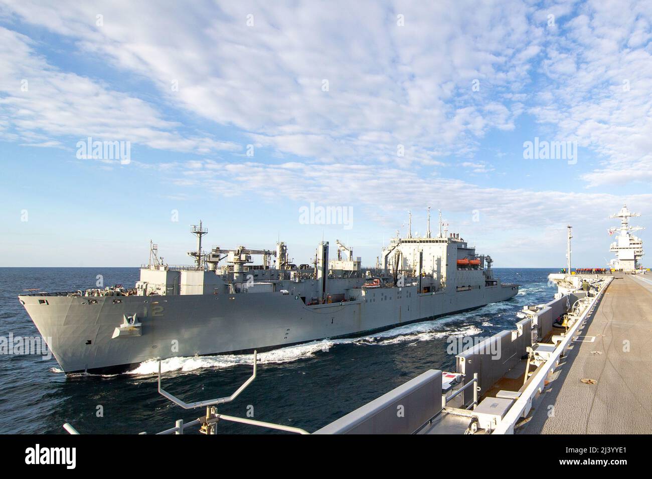 USNS William McLean (T-AKE 12), steams alongside USS Gerald R. Ford ...