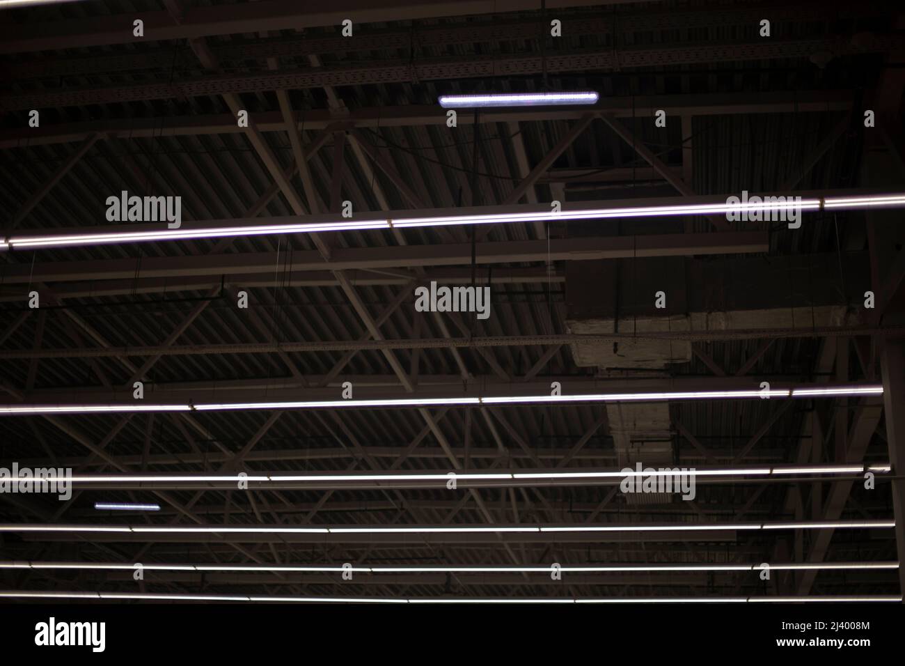 Warehouse ceiling. Lamps on the ceiling. Large room. Details of ...