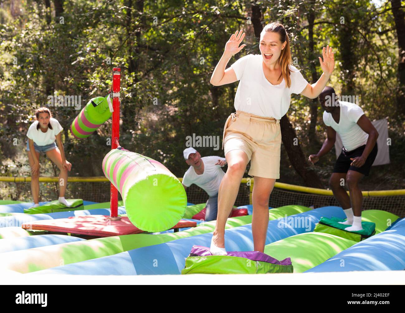 Men and women having active rest Stock Photo - Alamy