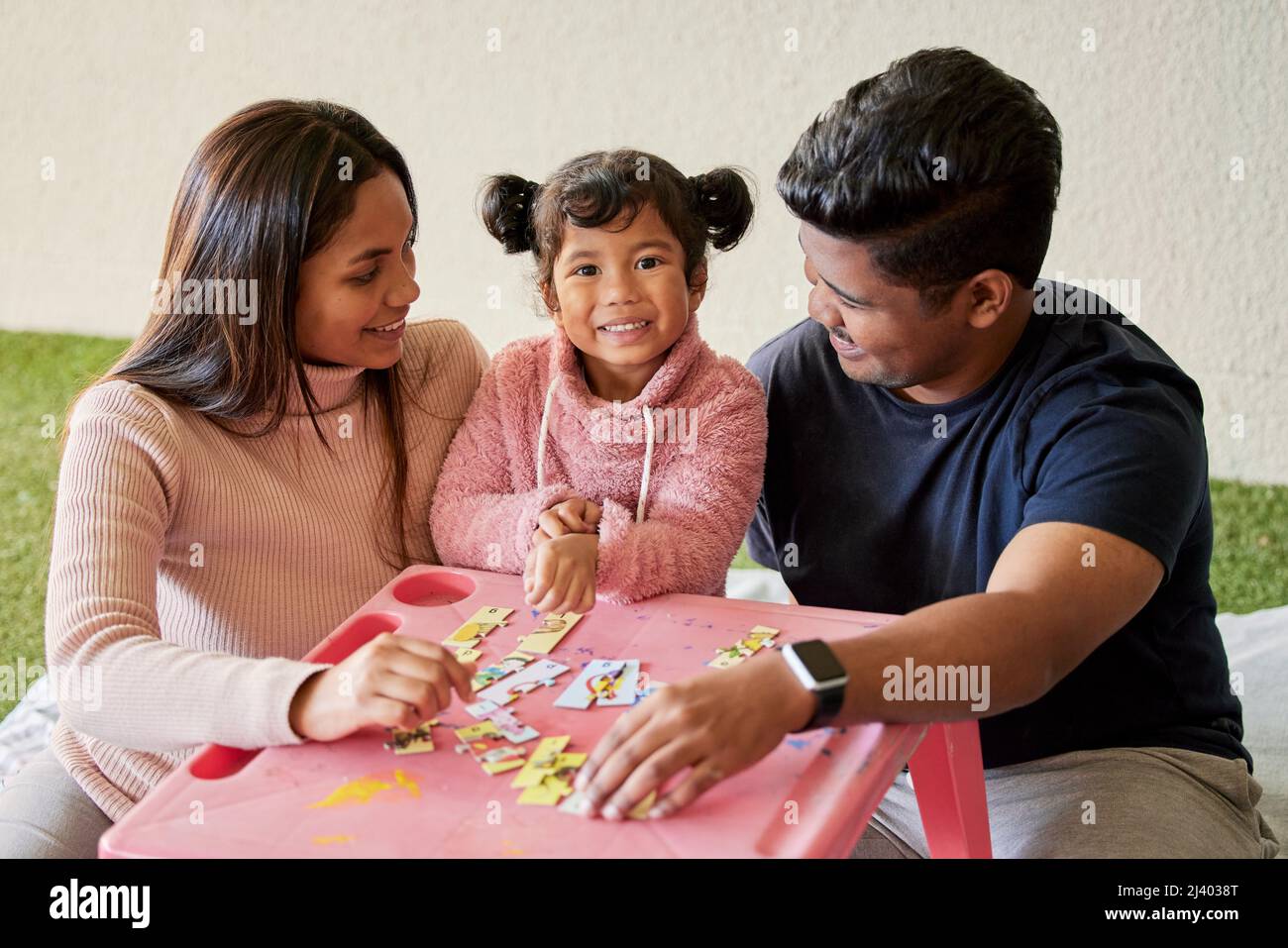 helping build my daughter mentally. Shot of young parents helping their ...