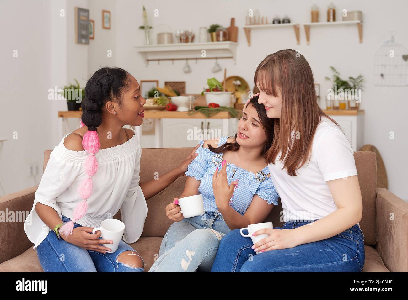 An unhappy woman talks about her problems to her friends at home. The ...
