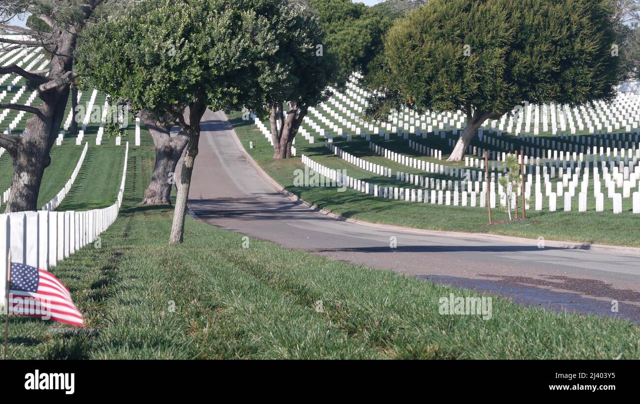 Tombstones and american flag, national memorial cemetery, military ...