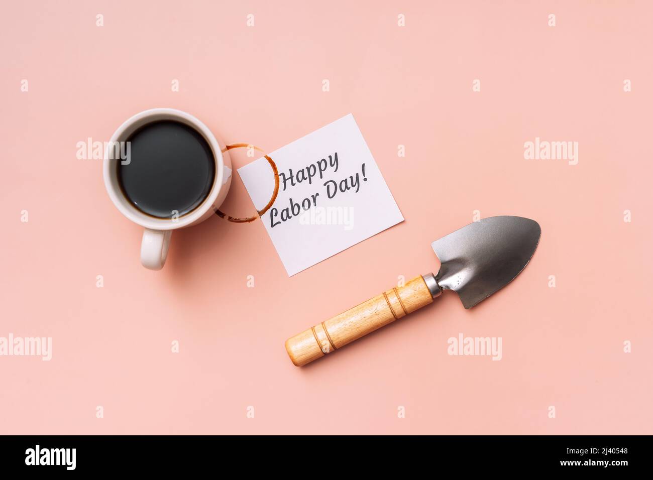 Happy labor day sticker with mug print next to small spatula Stock ...