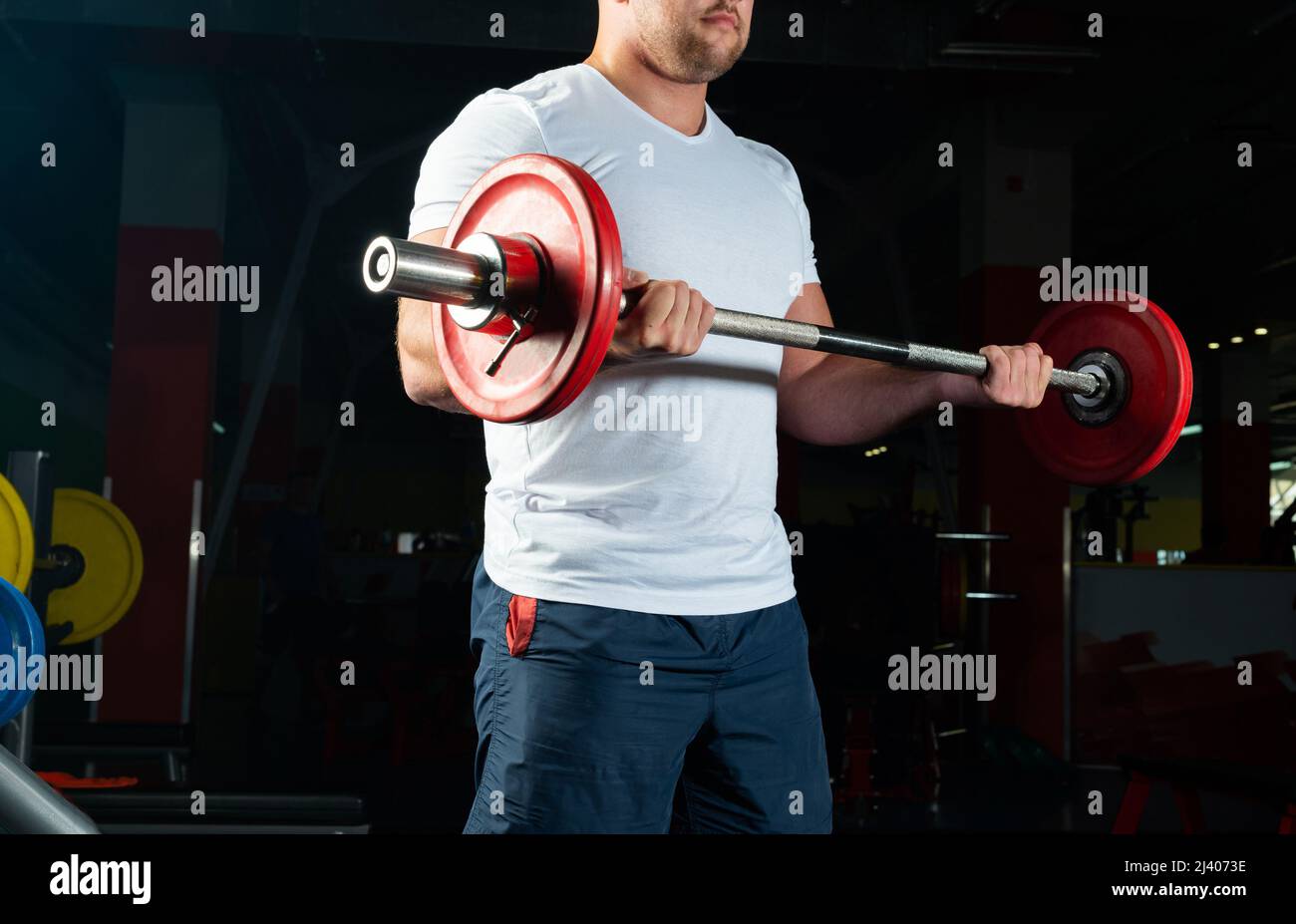 Young male athlete lifts barbell hi-res stock photography and images ...