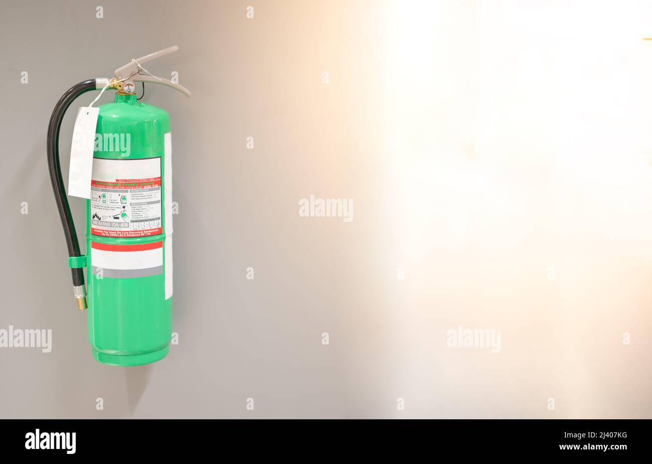 Fire extinguishers hanging on the wall are available in fire ...