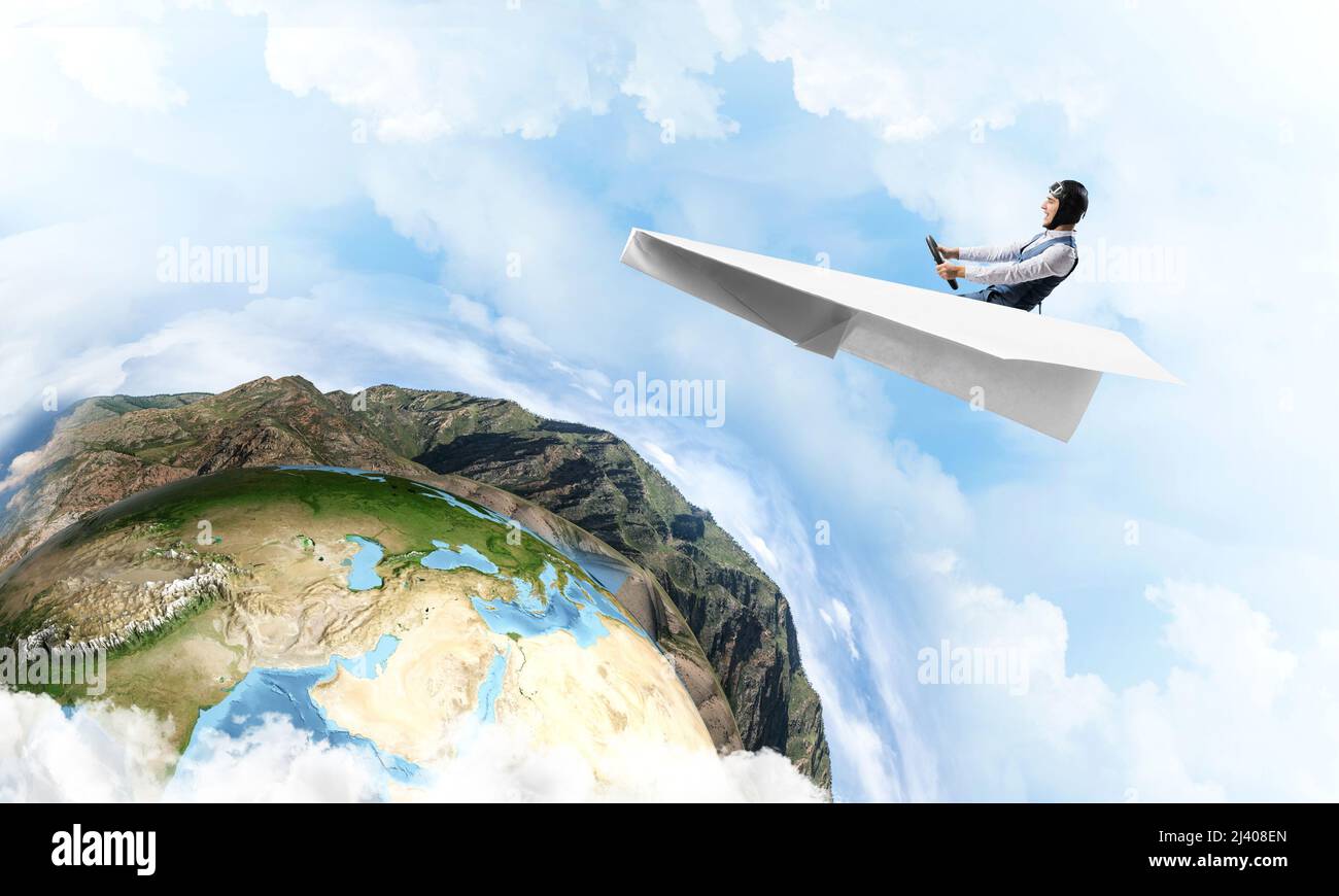 Pilot in leather helmet driving paper plane Stock Photo - Alamy