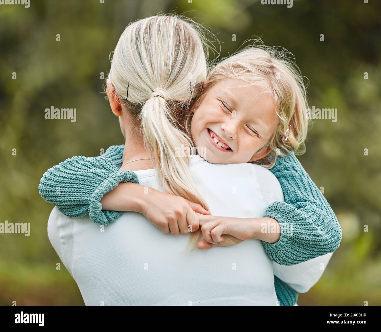 I want to hold on and never let go. Shot of a little girl and her ...