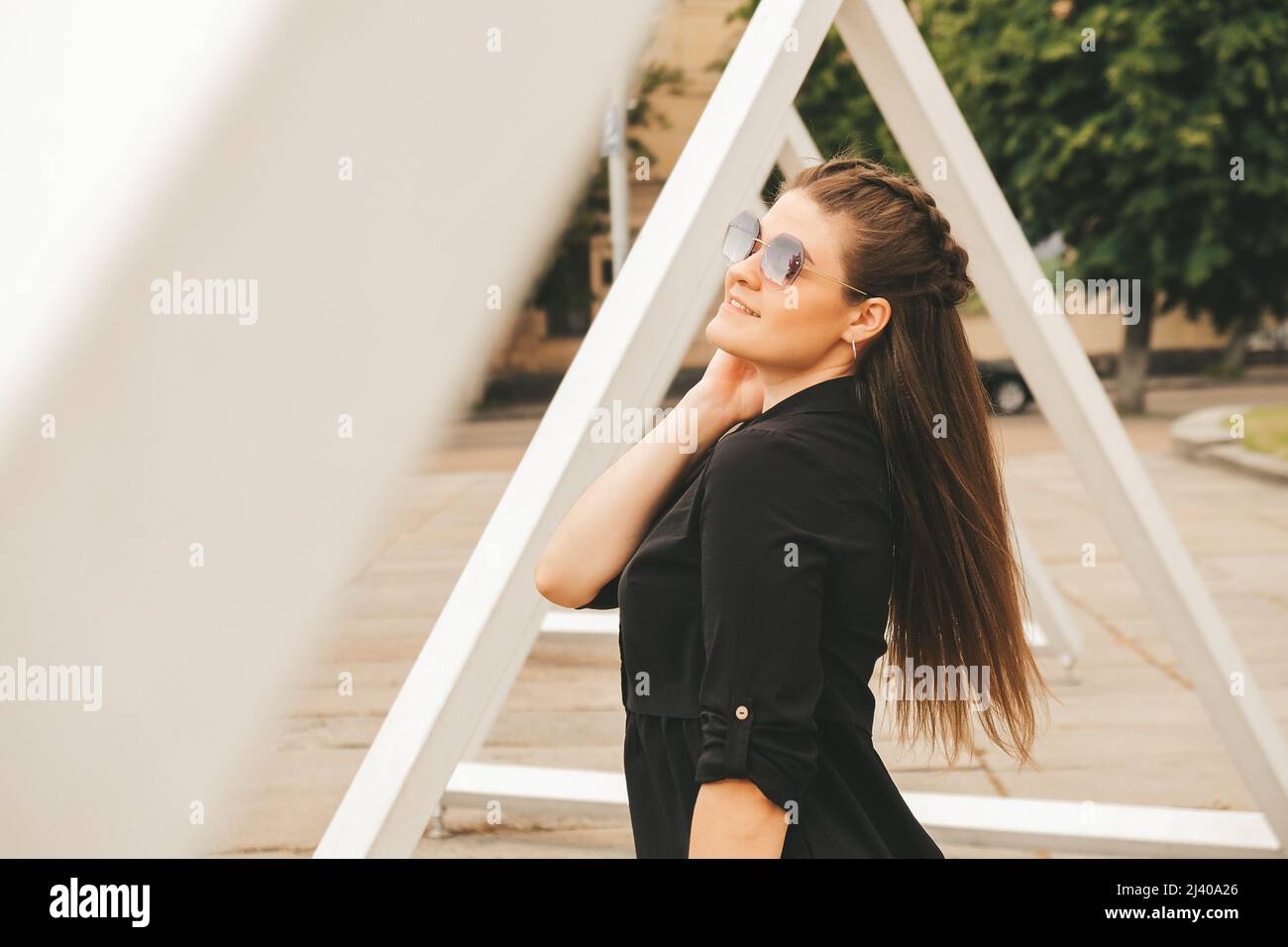 Portrait of young millennial woman on street. Hippie lifestyle. Happy ...