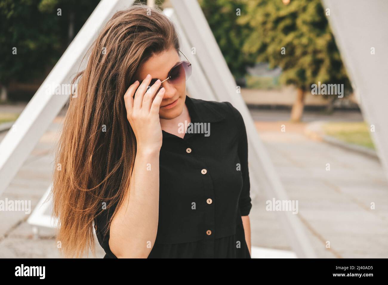 Portrait of young millennial woman on street. Hippie lifestyle. Happy ...