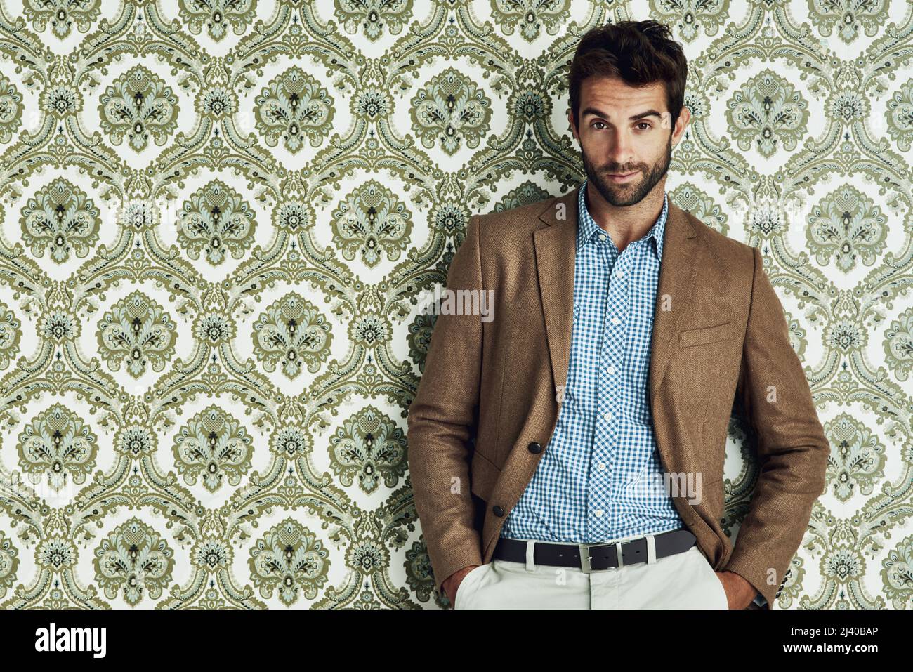 On that style grind. Studio shot a handsome and stylishly dressed young ...