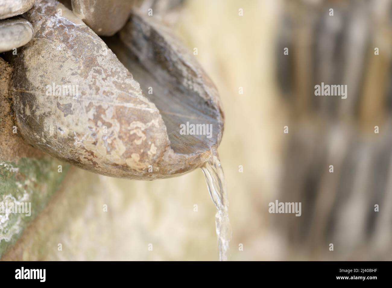 Jet of water flowing from stoneless mountain spring closeup Stock Photo ...