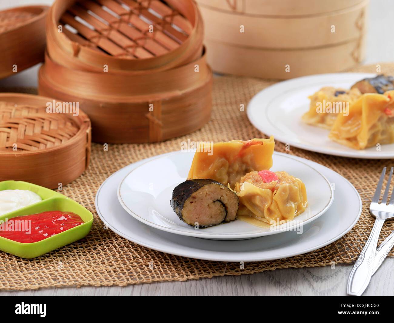 Various Dim sum on White Plate, Shumay, Nori Roll, and Shrimp Kuotie ...