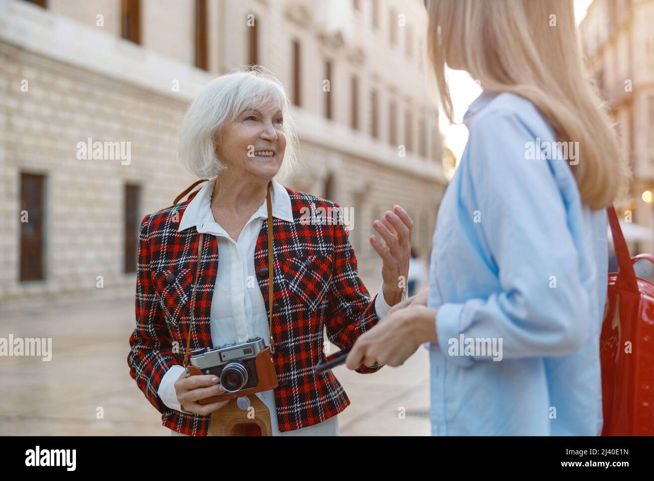 Senior lady spending time at urban area Stock Photo - Alamy