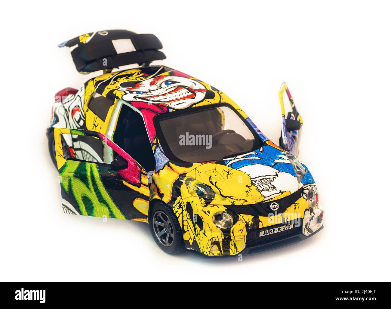 2021: toy model of the colorful rally car SUV Nissan Juke R, on white ...