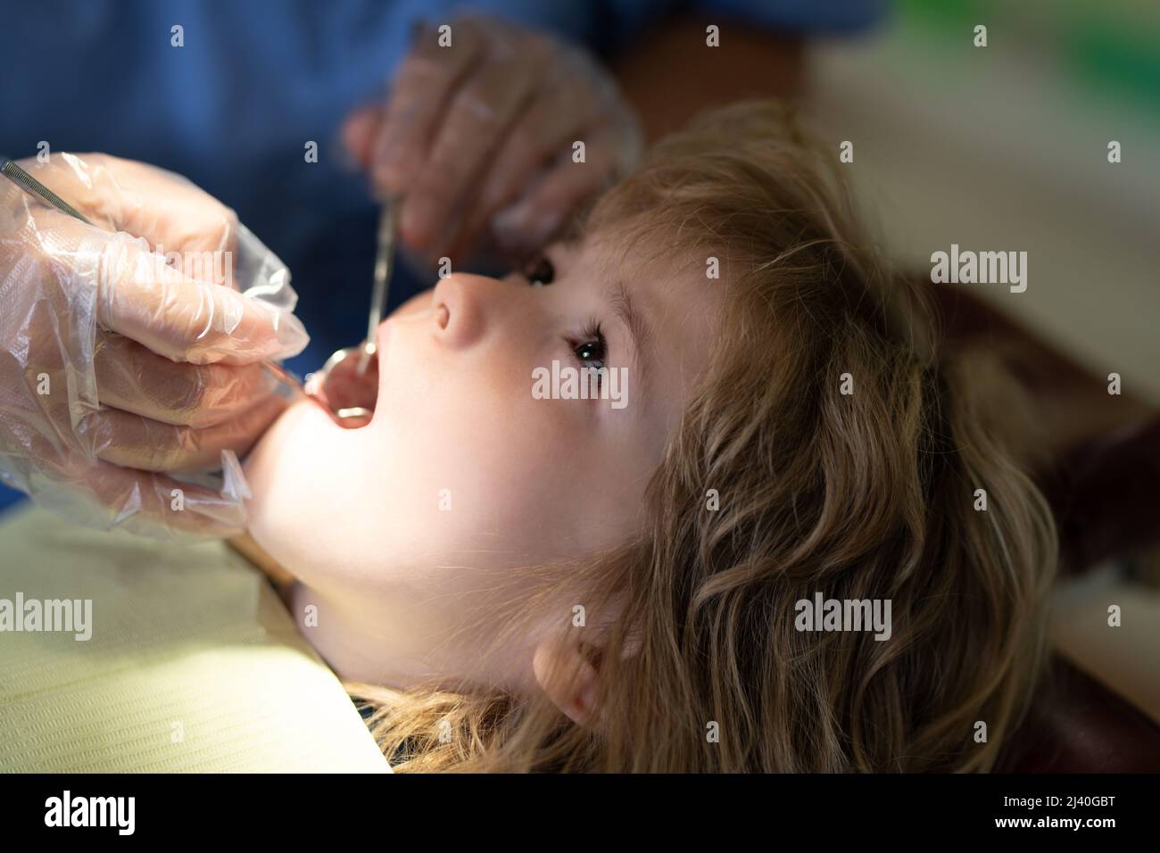 Dental kids health examination. A child with a dentist in a dental ...