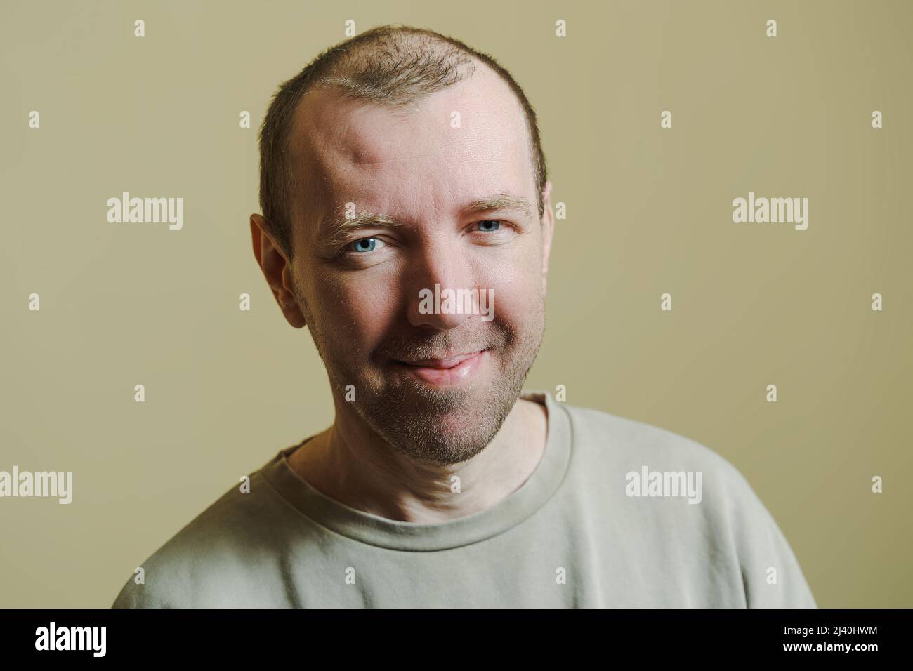 The man looks ironically. Portrait of a young man making faces Stock ...