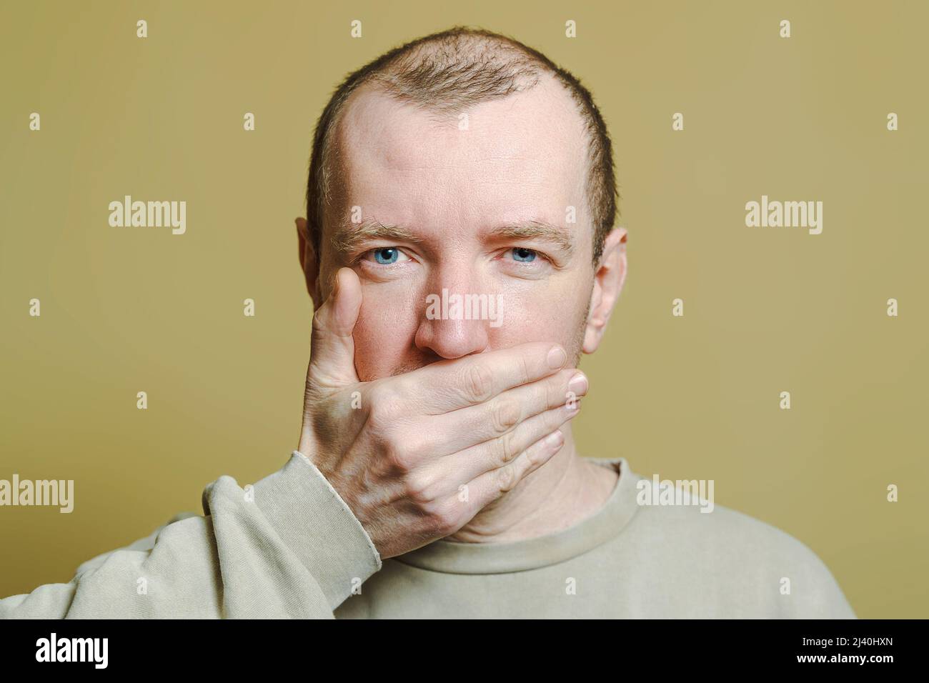 The Man Covered His Mouth With His Hand Portrait Of A Young Man Making