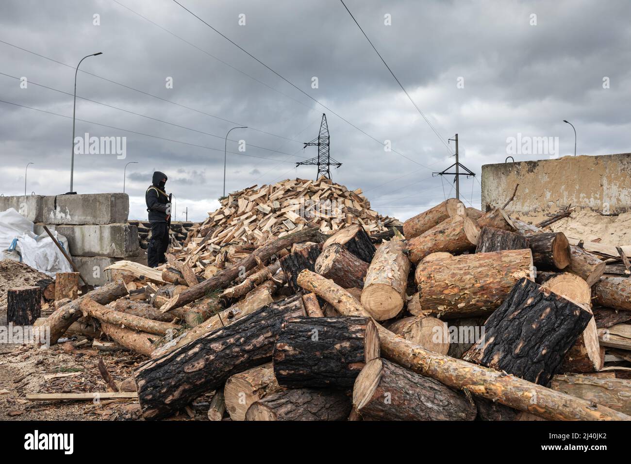 A pile of logs is seen at the territorial defense checkpoints in the ...