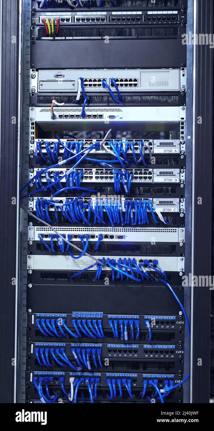 Blue wires all around. Cropped shot of the inside of a computer with ...