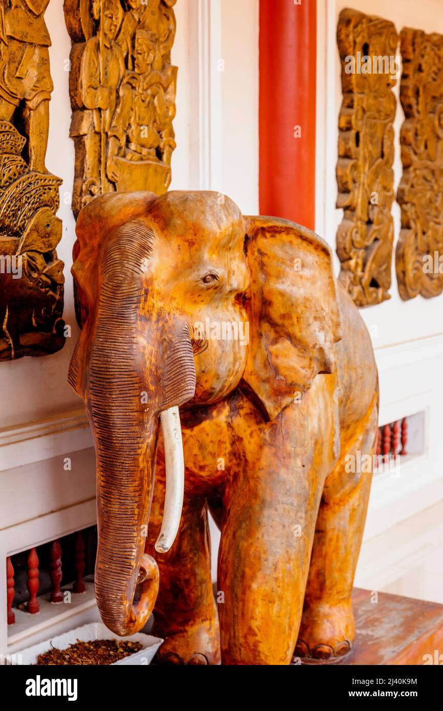 Statue of an baby elephant in front of Quang Trung Museum building ...
