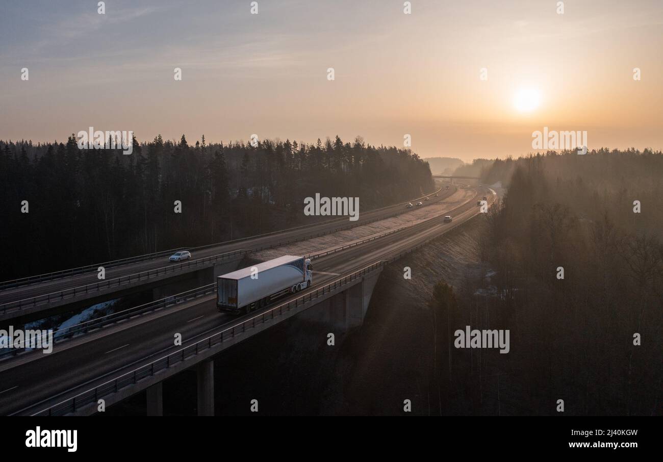 Cargo truck on a highway in spring morning Stock Photo - Alamy