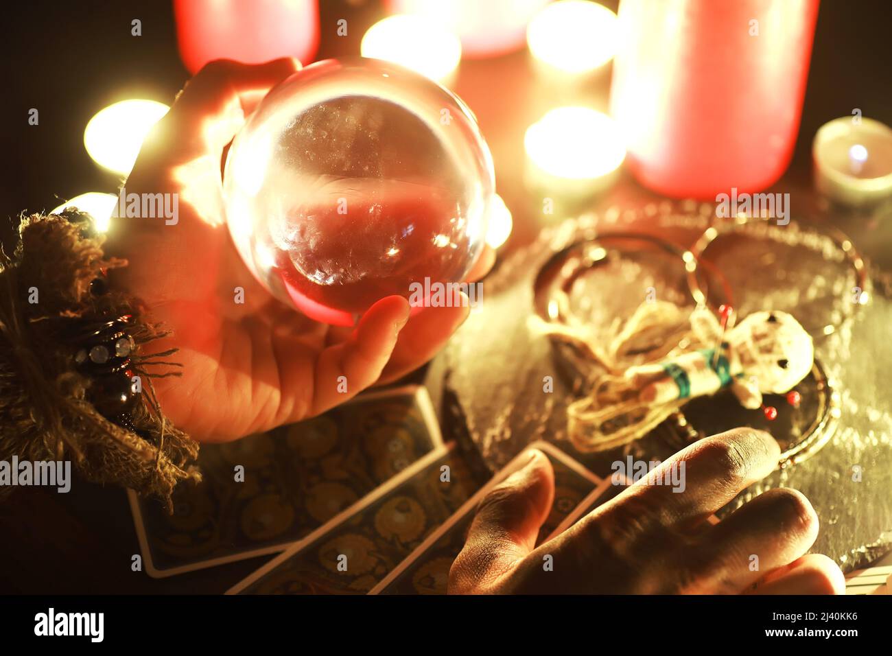 Mystic still life with voodoo doll, the tarot cards, books, evil ...